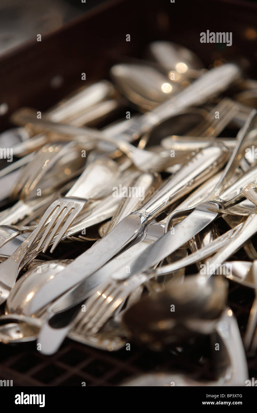 Silver cutlery set in a restaurant Stock Photo - Alamy