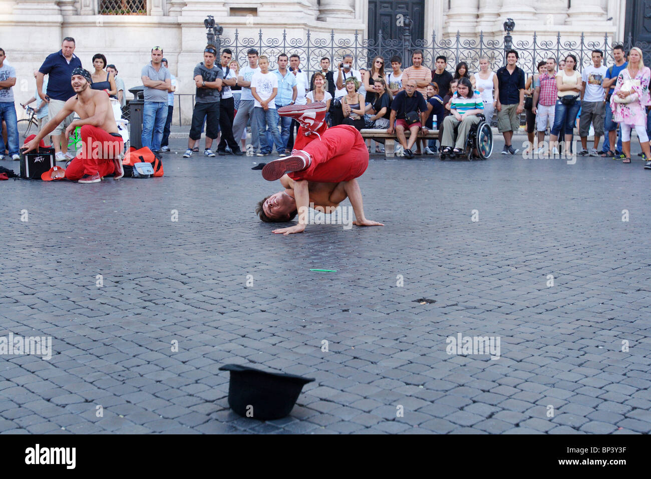 Young street artists dance brakdance acrobatic live in Navona square ...