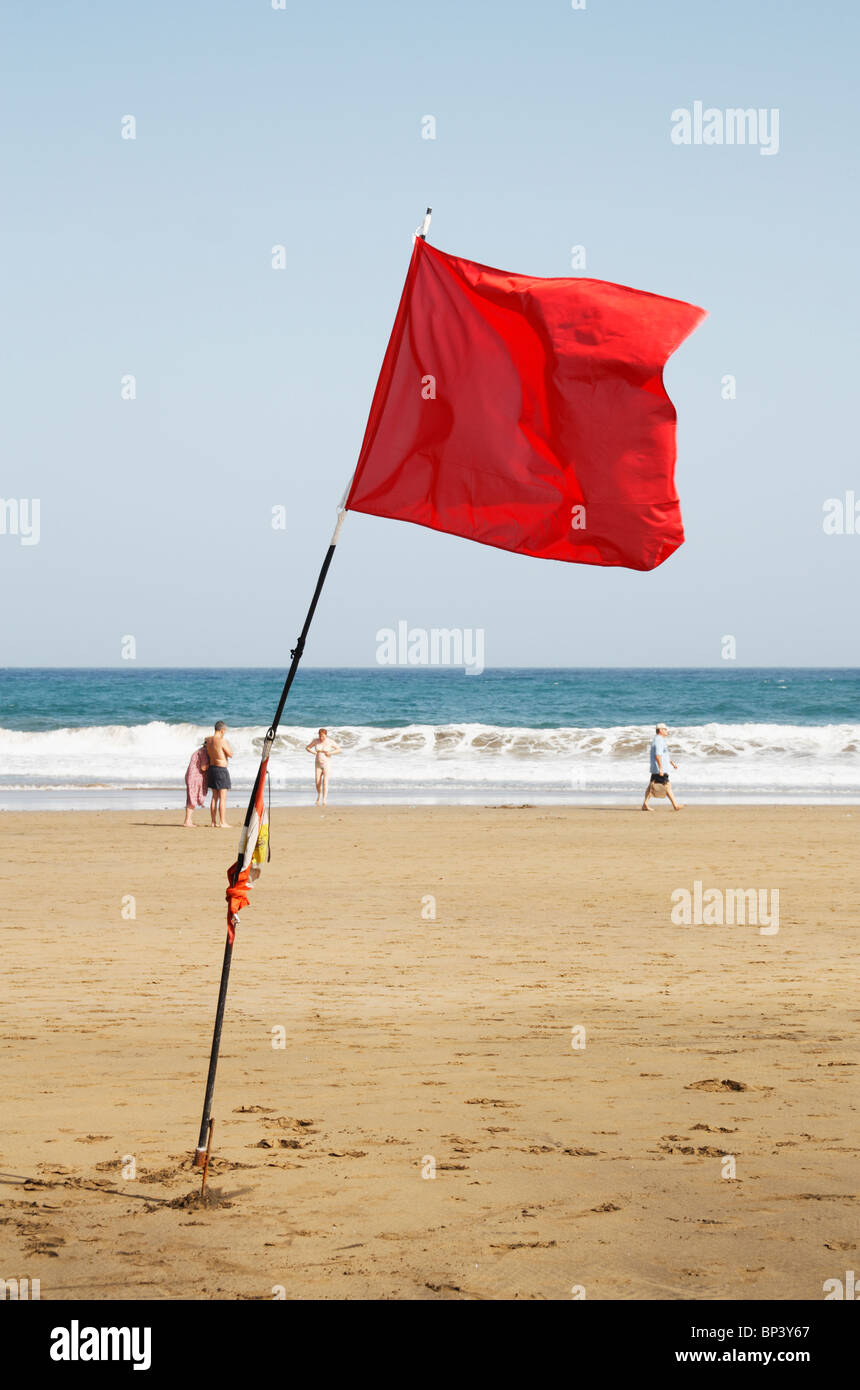 Red flag on beach Stock Photo - Alamy