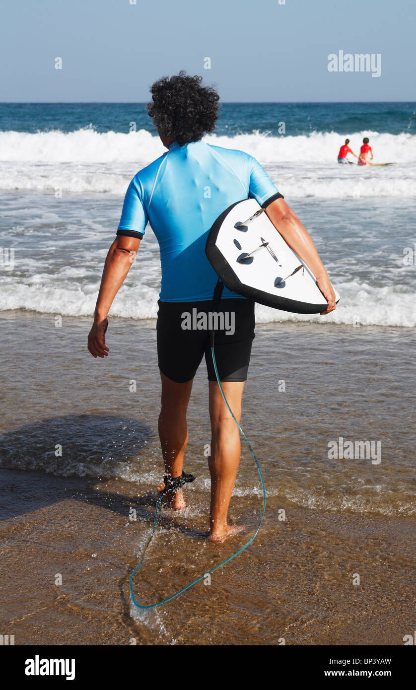 Entering the surf hi-res stock photography and images - Alamy
