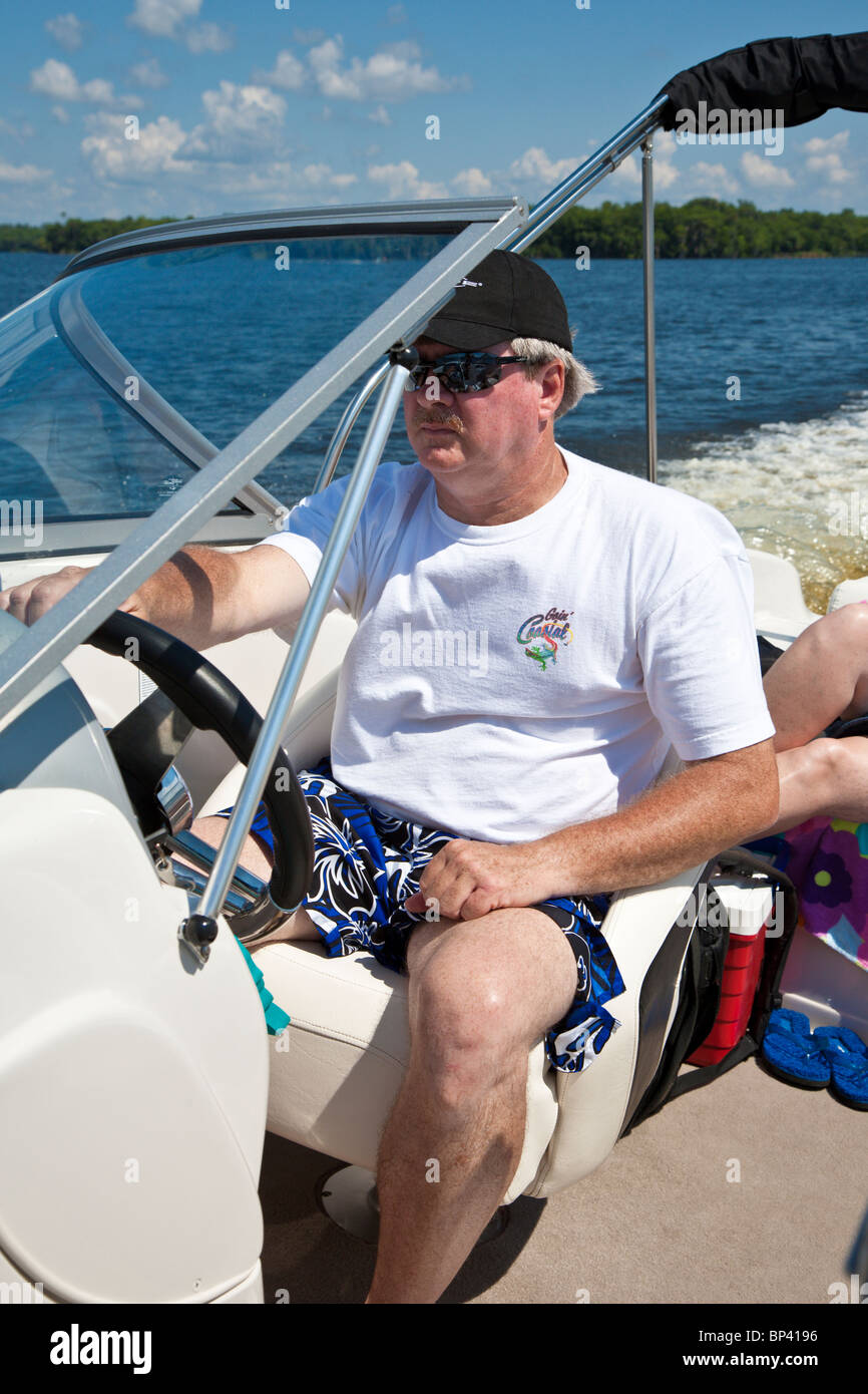 Lake George, FL - May 2010 - Man driving speed boat on Lake George in ...