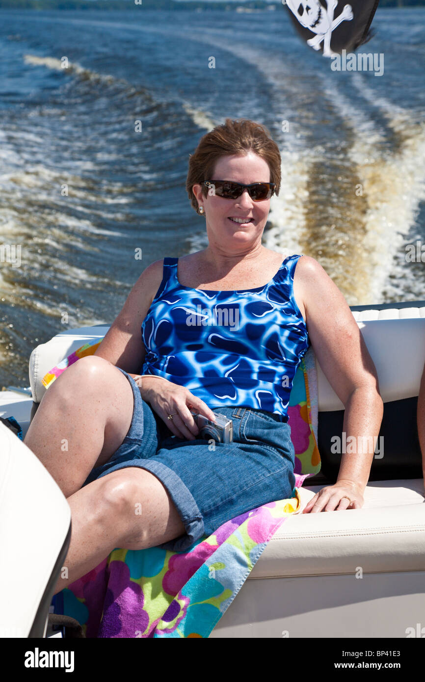 Woman driving boat hi-res stock photography and images - Alamy