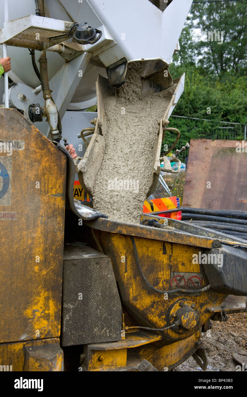 Concrete being transfered from transporter into concrete pump Stock ...