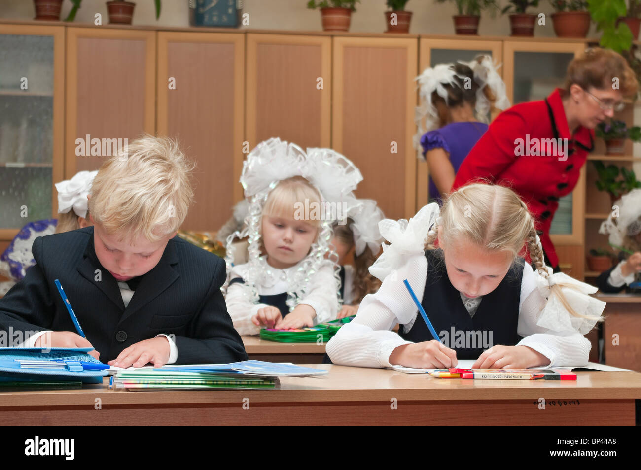 Russian boys and girls Caucasians students are sitting on the lesson in ...