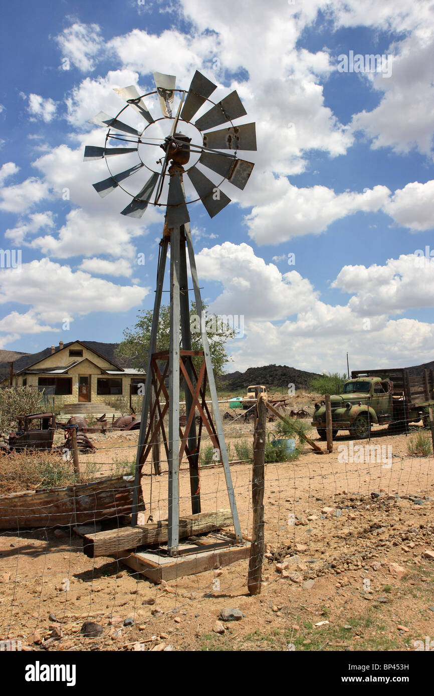 Wind wheel and a house in the desert of Arizona, Hackberry, USA Stock ...