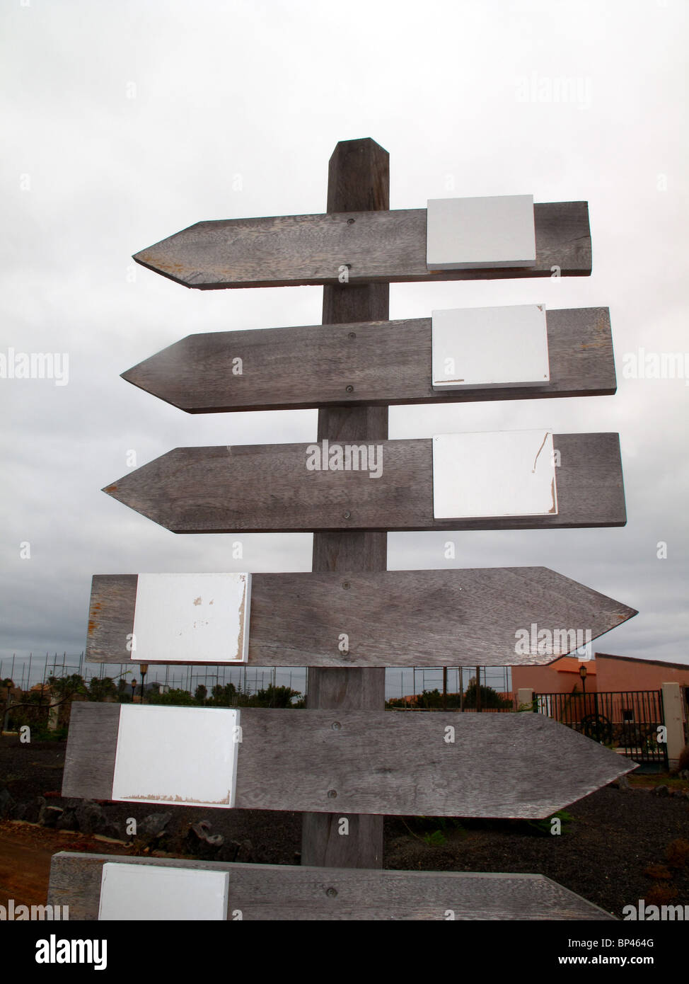 Blank wooden direction sign arrows Stock Photo - Alamy