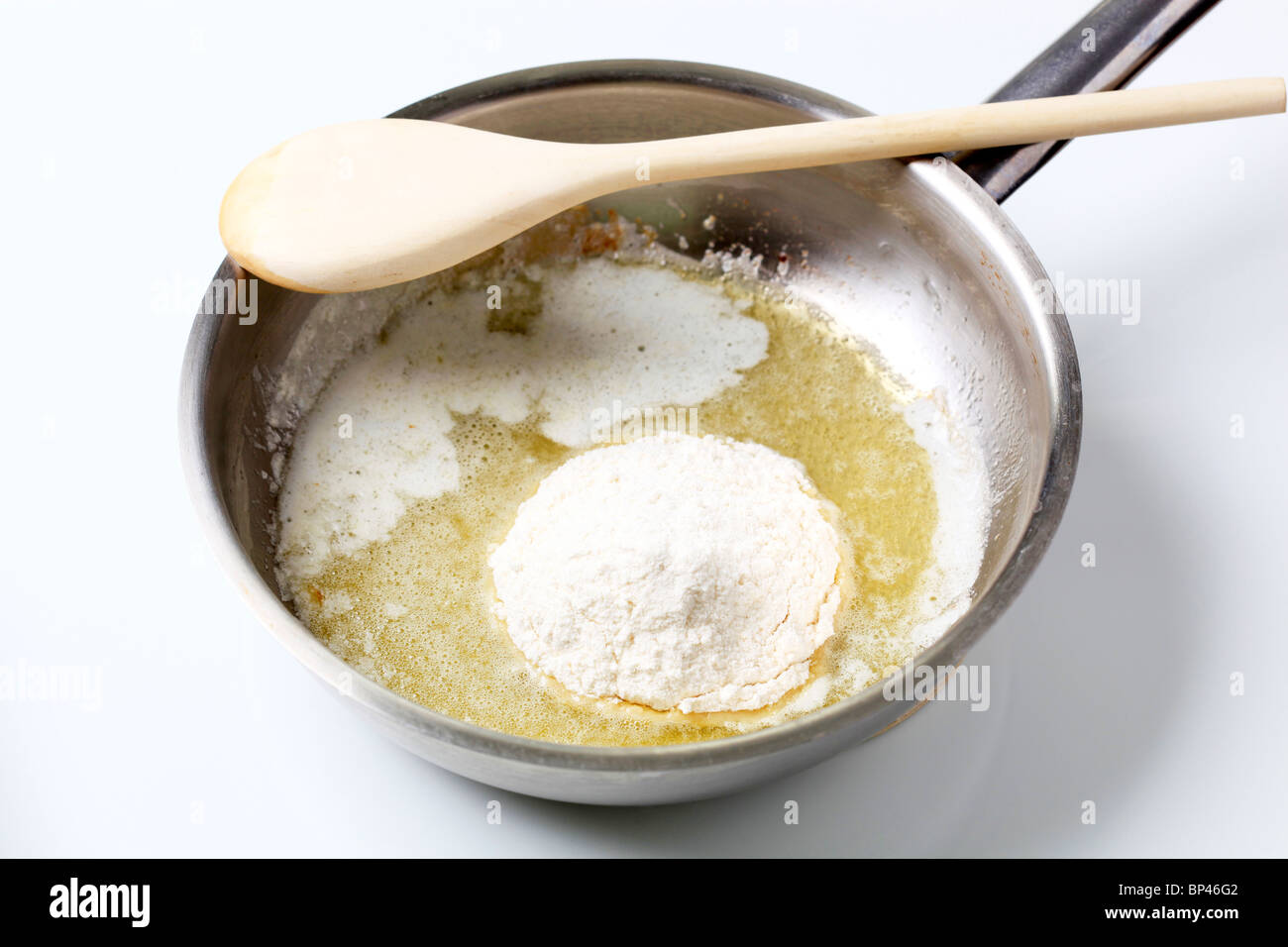 Wheat flour and heated butter in a saucepan Stock Photo - Alamy
