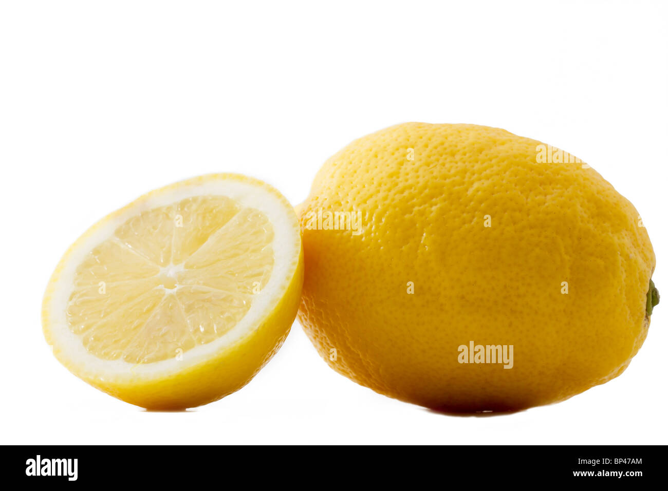 one lemon and a half on white background Stock Photo - Alamy