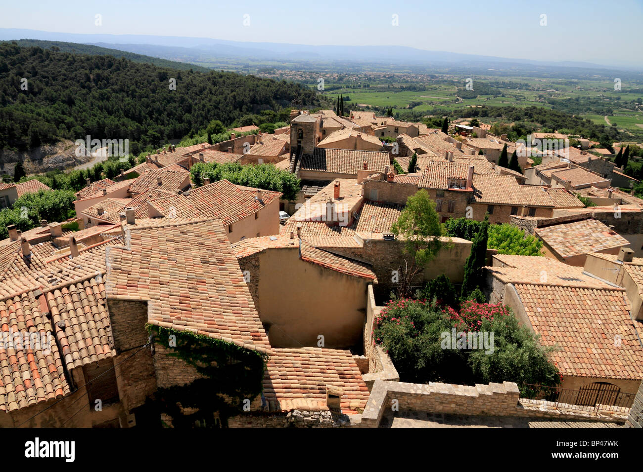 View looking over French village tiled rooftops at Le Barroux, Provence ...