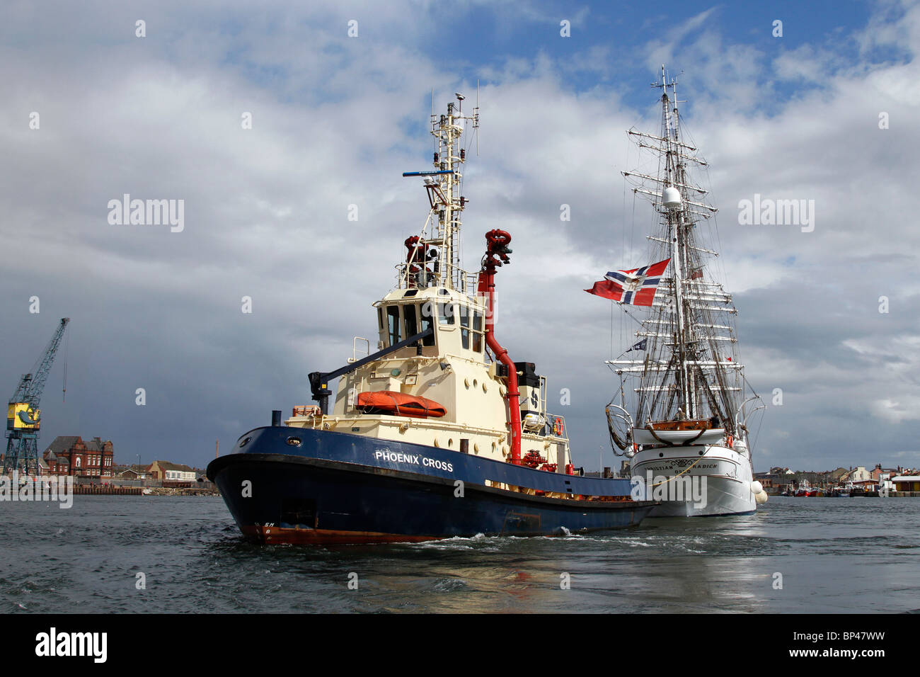 Tugboat Phoenix Cross Class A hitched to Christian Radich Tall ...