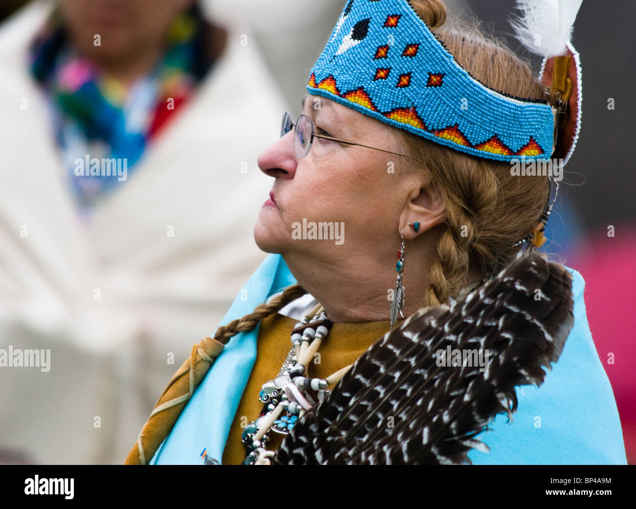A Native American dresses in full traditional regalia at the Healing ...