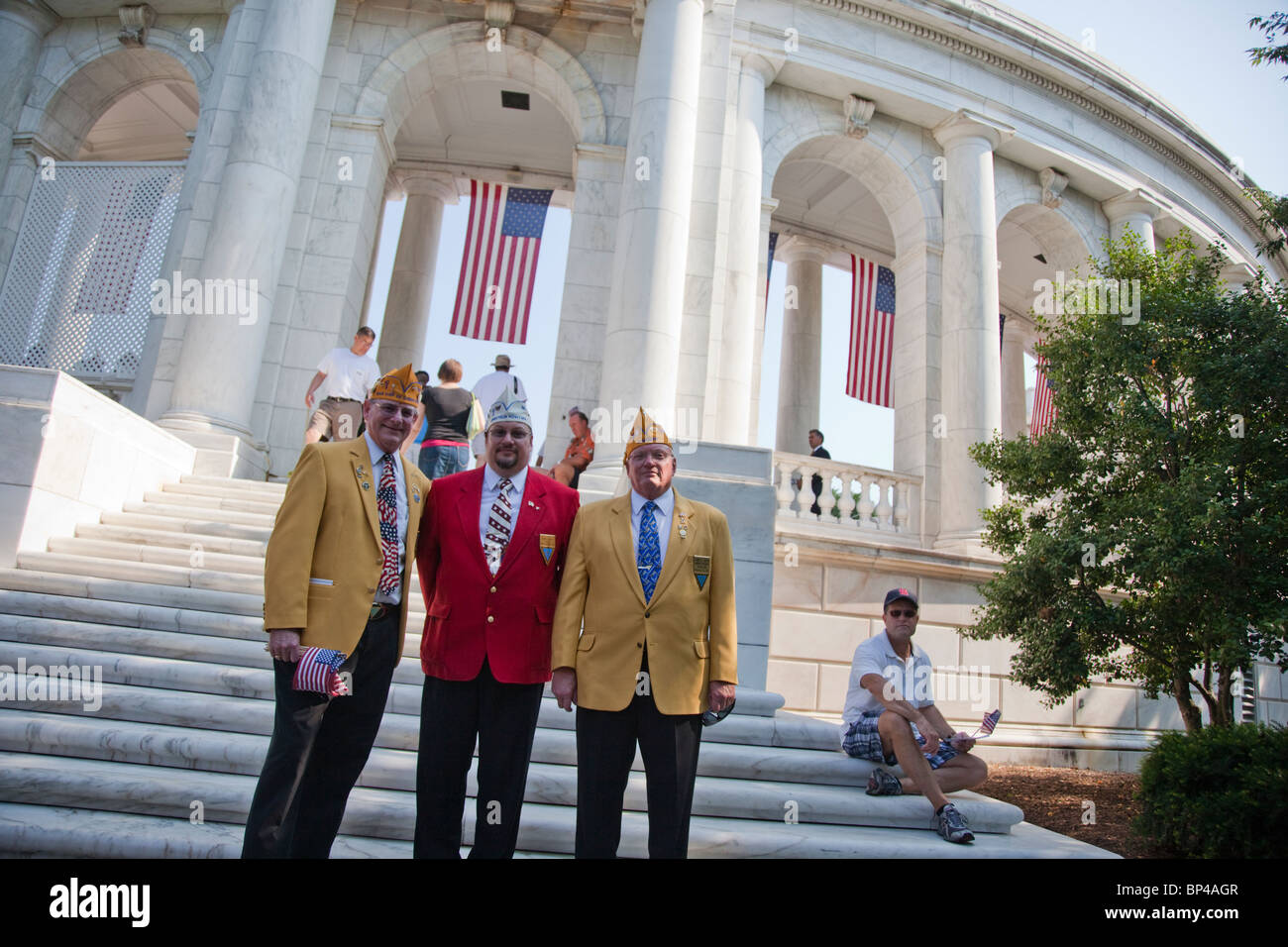 Veterans pass out American flags to visitors at the Arlington National ...