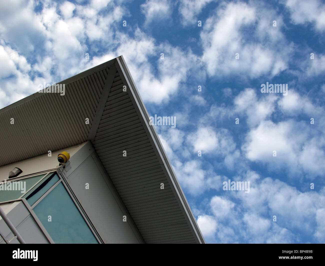Modern building with blue sky and clouds Stock Photo - Alamy