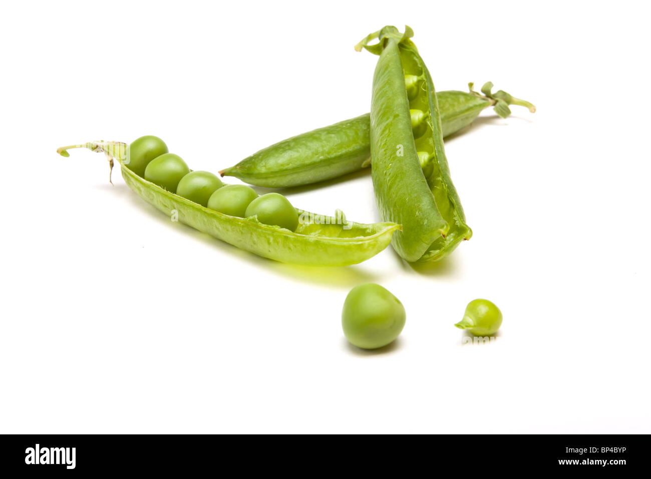 Fresh Pea Pods from low perspective isolated against white background Stock Photo - Alamy