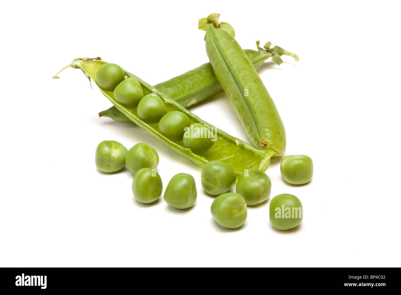 Fresh Pea Pods from low perspective isolated against white background Stock Photo - Alamy