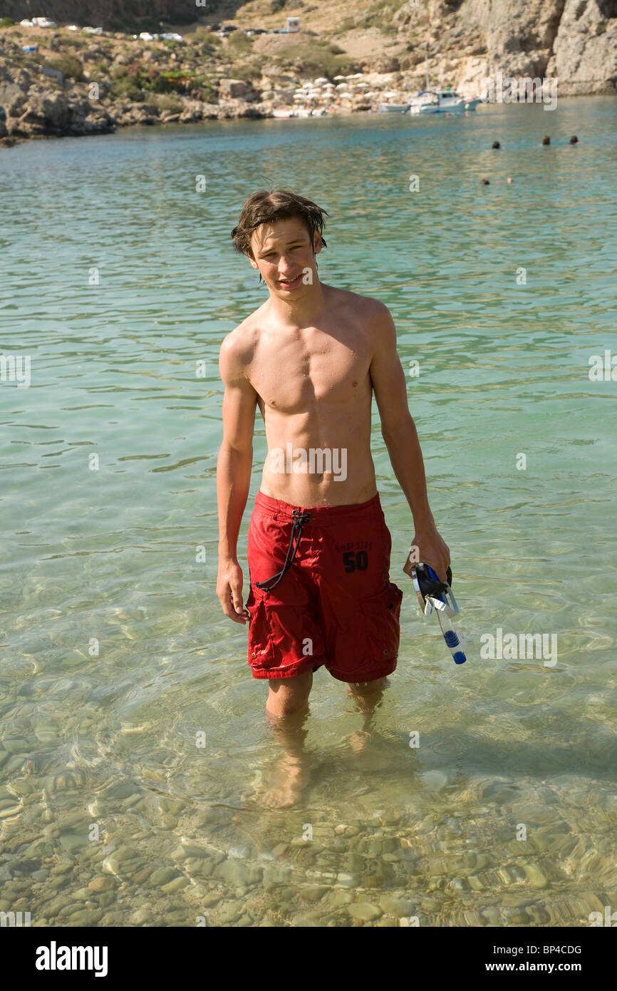 Teenage boy standing Mediterranean sea Stock Photo - Alamy