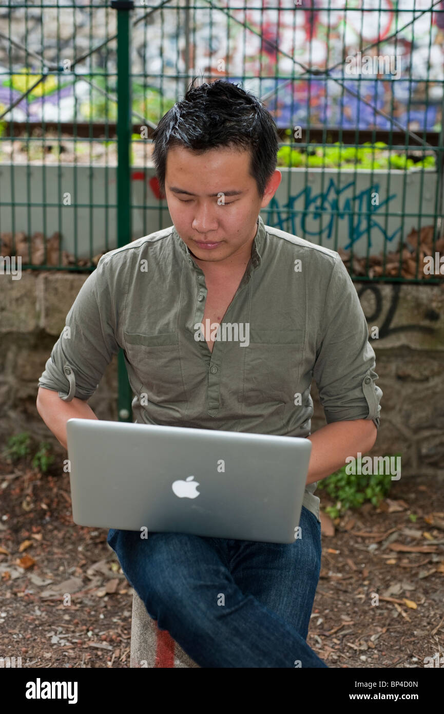 Young Adult, Asian Man, Looking at Laptop Computer Screen, Alone ...