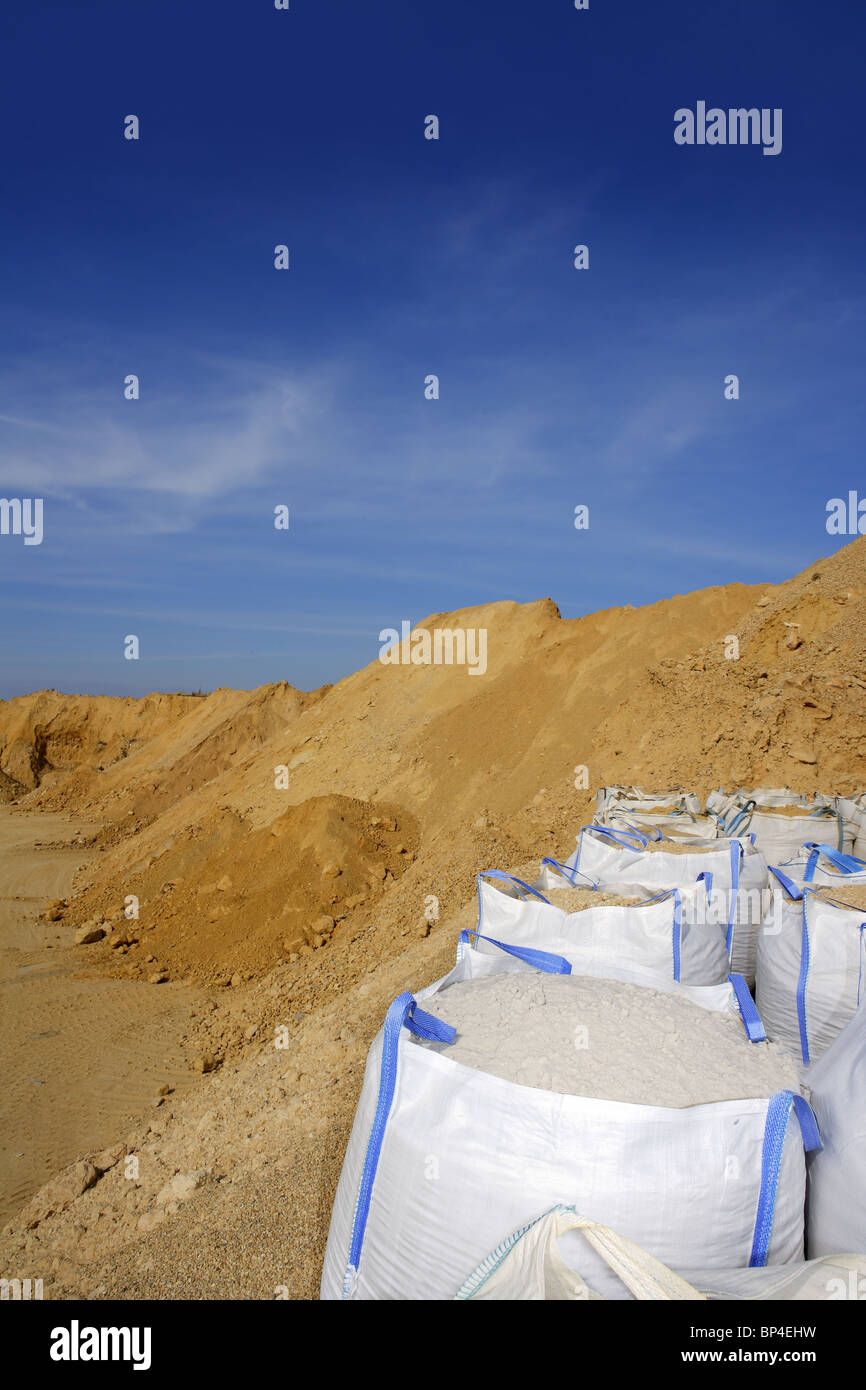 sandbag white big bag sand sacks quarry perspective Stock Photo - Alamy