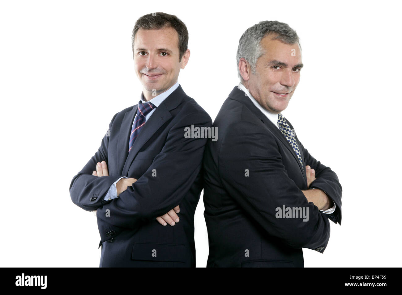 two adult businessman posing back together team portrait Stock Photo ...
