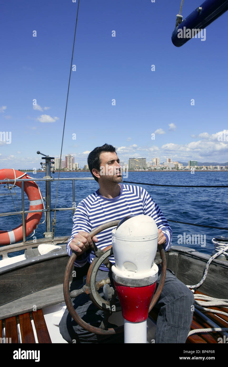 blue sailor man sailing vintage wooden sailboat mediterranean sea Stock ...