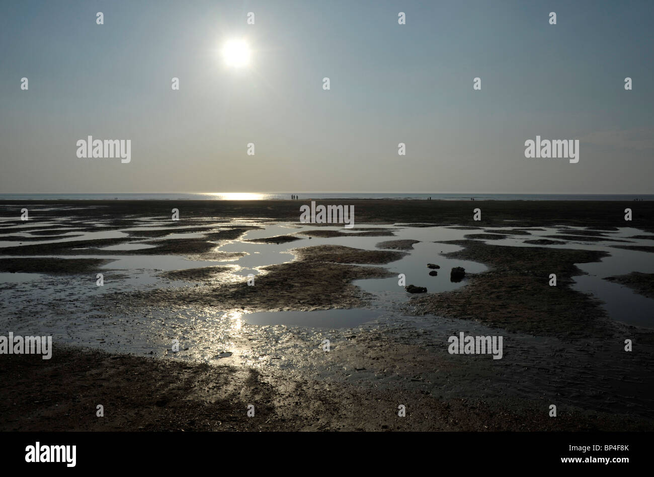 Sunset on Hunstanton beach with distant figures, Norfolk Stock Photo ...