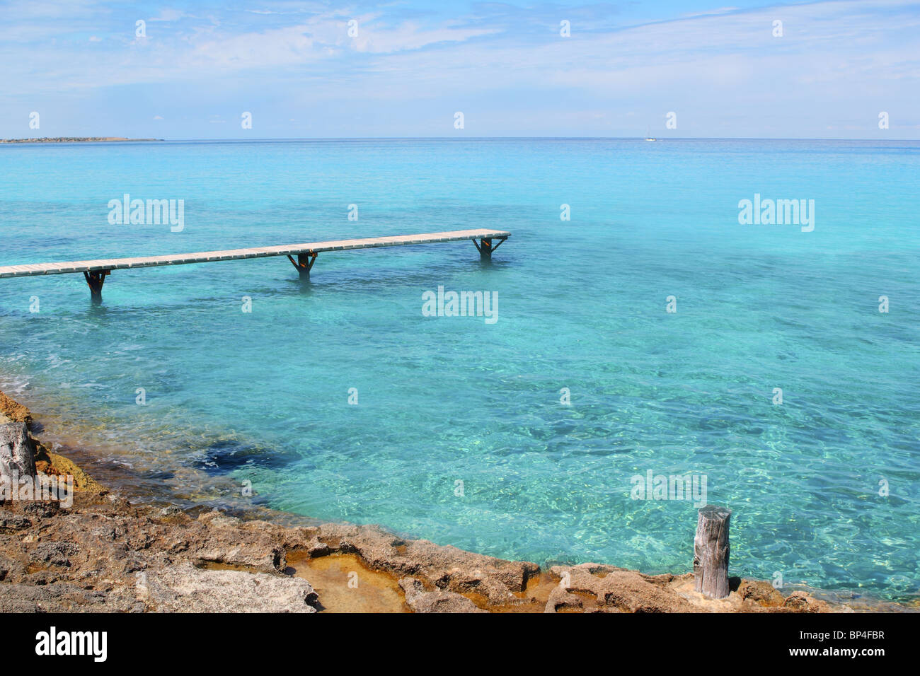 Formentera Illetes turquoise sea wooden pier aged trunk Illetas Stock ...