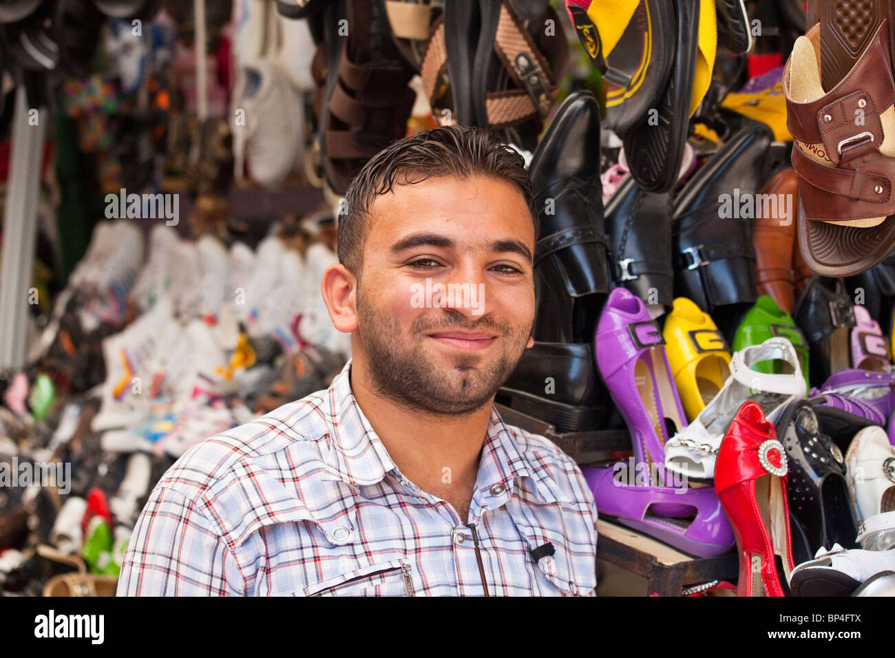 Kurdish Iraqi shoe vendor in the bazaar, Dohuk, Kurdistan, Iraq Stock ...