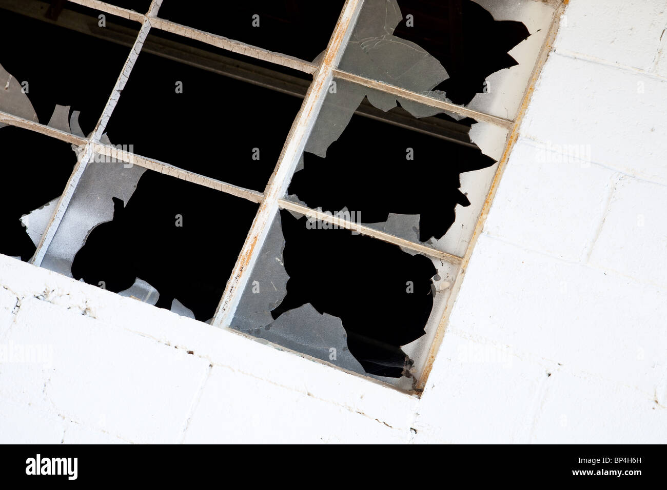 Broken windows in an old building Stock Photo - Alamy