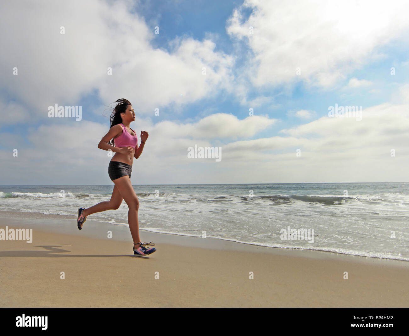 Runner in the beach hi-res stock photography and images - Alamy