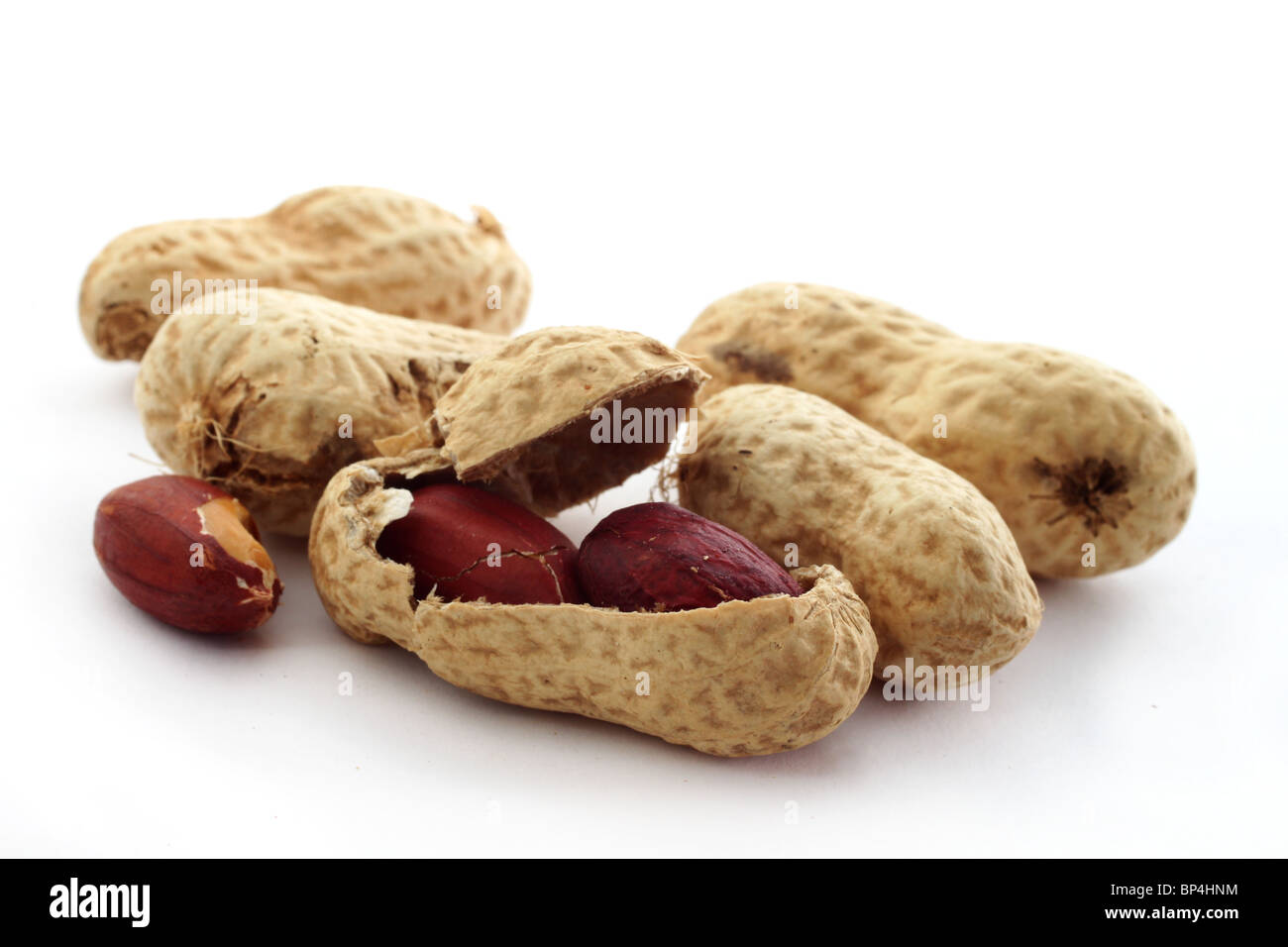 Peanuts over white background Stock Photo - Alamy