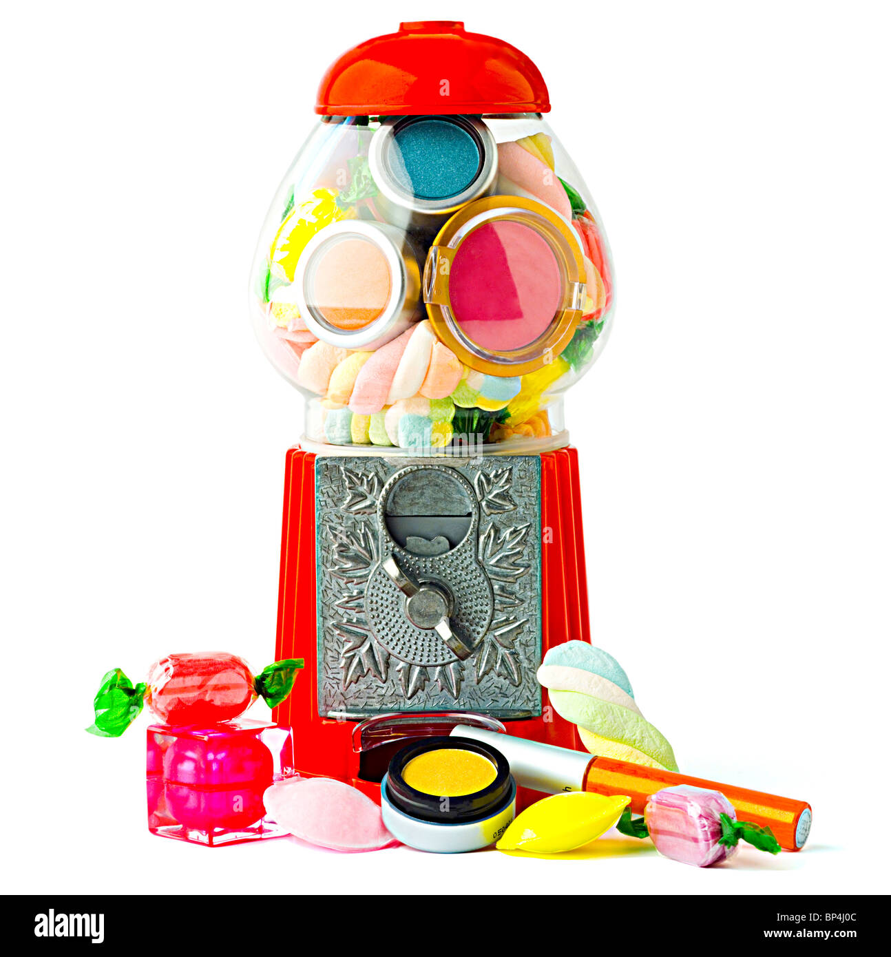 A red jelly bean coin operated sweet machine with sweets and makeup ...