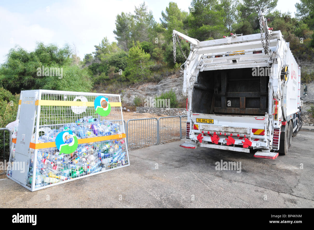 Truck collects plastic bottles for recycling Stock Photo - Alamy