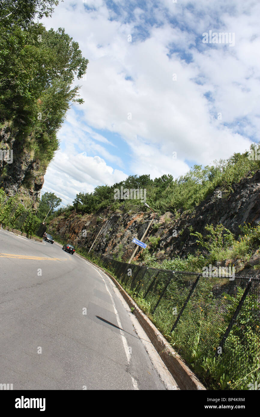 road tilted blue sky mountain green Stock Photo - Alamy