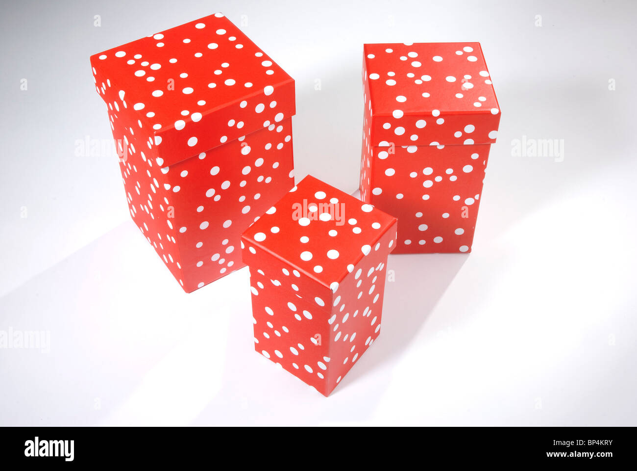 Three red Valentine boxes w white spots Stock Photo - Alamy