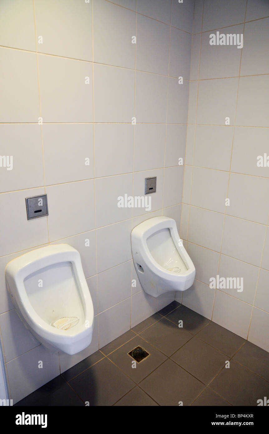 communal Urinal and wash basin Stock Photo - Alamy