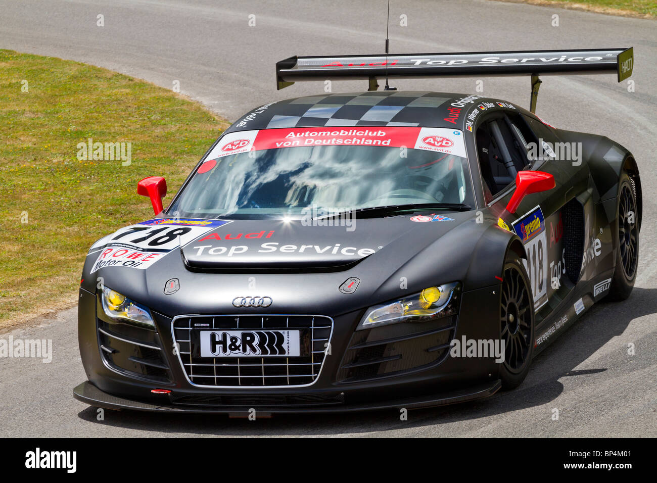 2010 Audi R8 LMS with driver Marco Werner at the 2010 Goodwood Festival ...