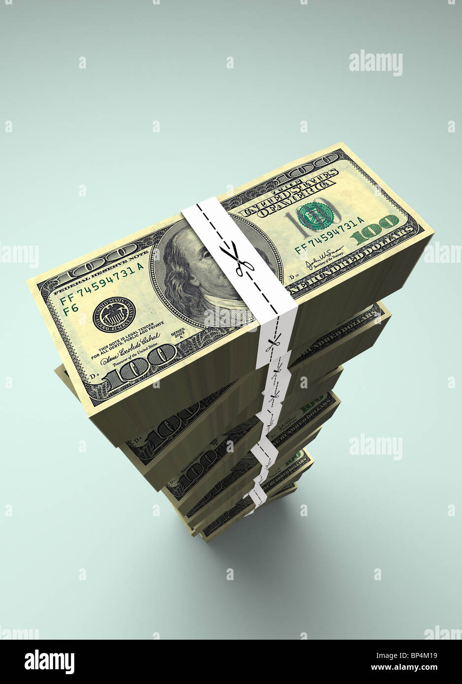 Large Stack of $100 Dollar USA bank notes with scissors cutting along ...