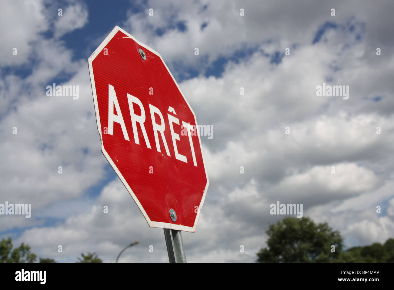 arret stop sign blue sky white cloud Stock Photo - Alamy
