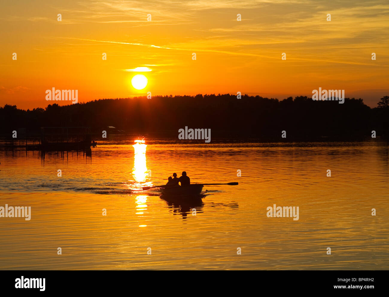 sunset on the lake, boat Stock Photo - Alamy
