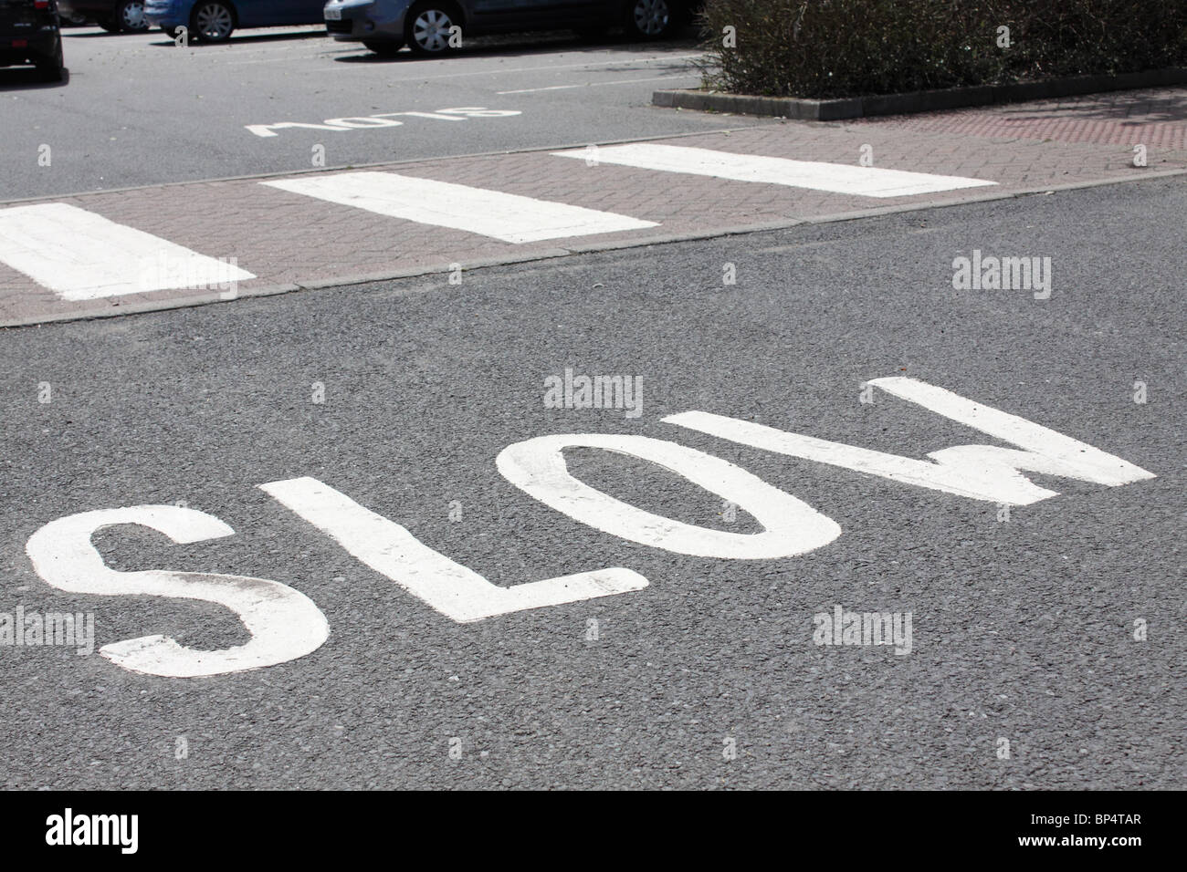 Slow road marking hi-res stock photography and images - Alamy