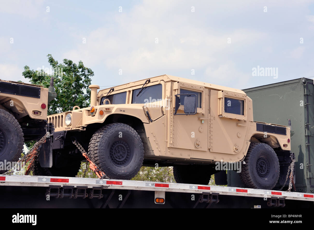 US military trucks being transported on large truck Stock Photo - Alamy