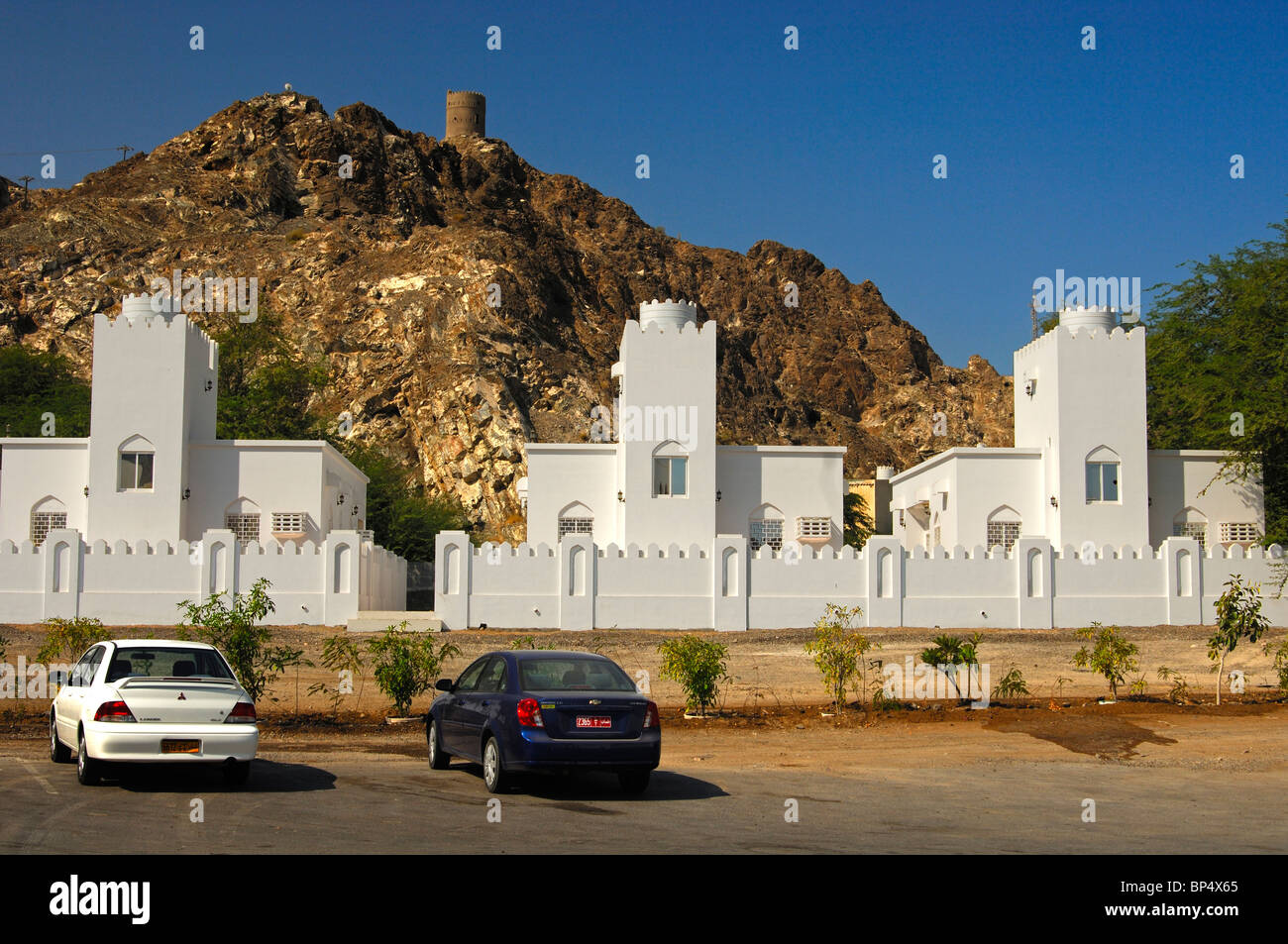 New family homes beneath an old fortress in the periphery of Muscat ...