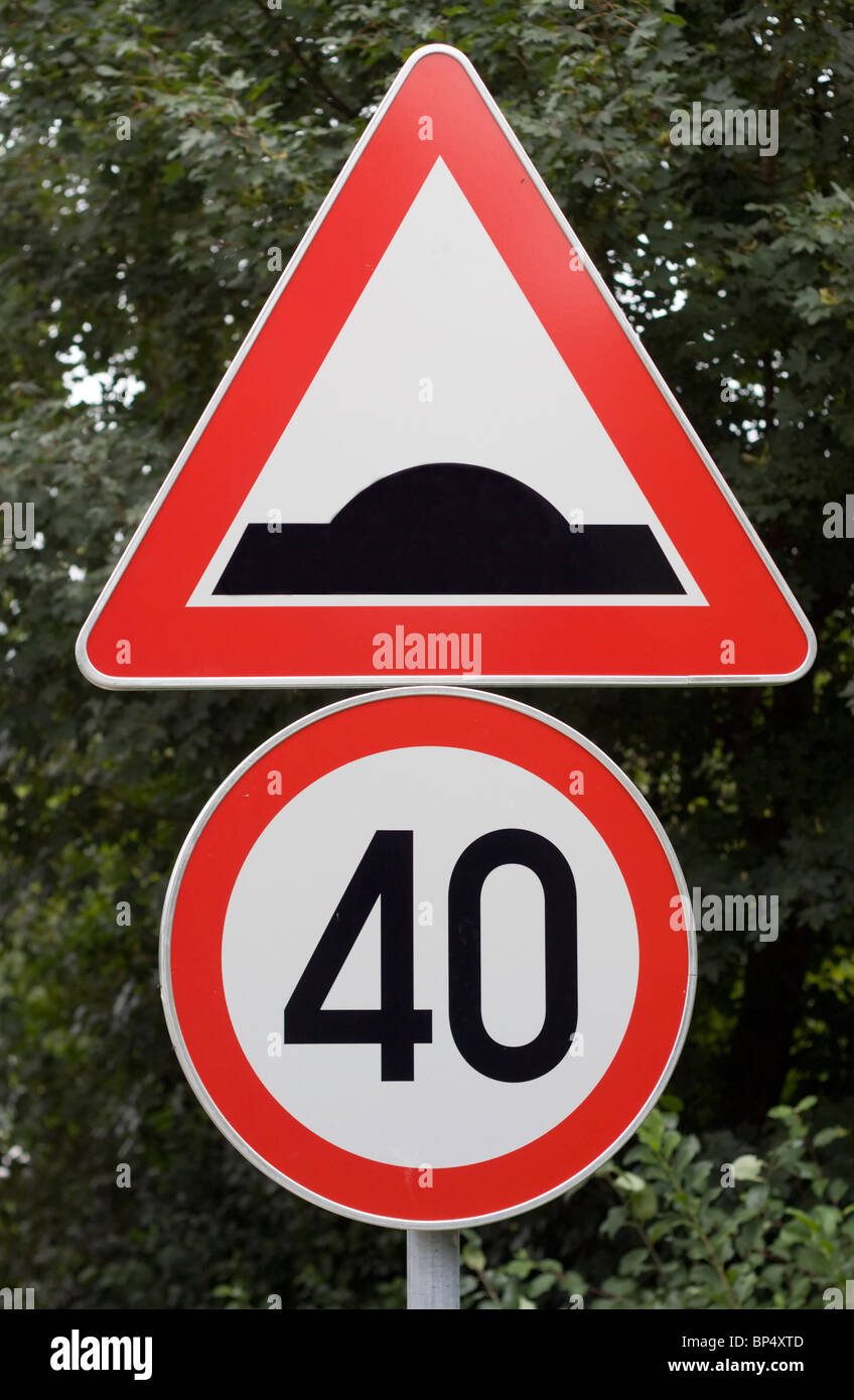 Warning sign and speed limit sign Stock Photo - Alamy