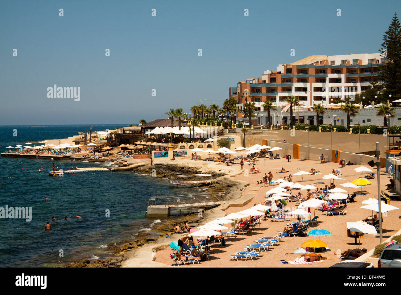 People enjoying the beach in Bugibba, Malta Stock Photo - Alamy