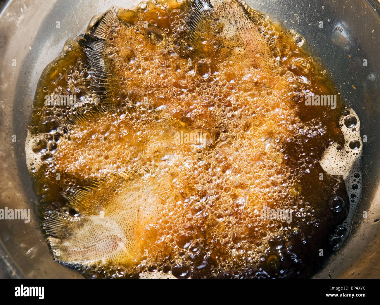 Fry fish saucepan hi-res stock photography and images - Alamy