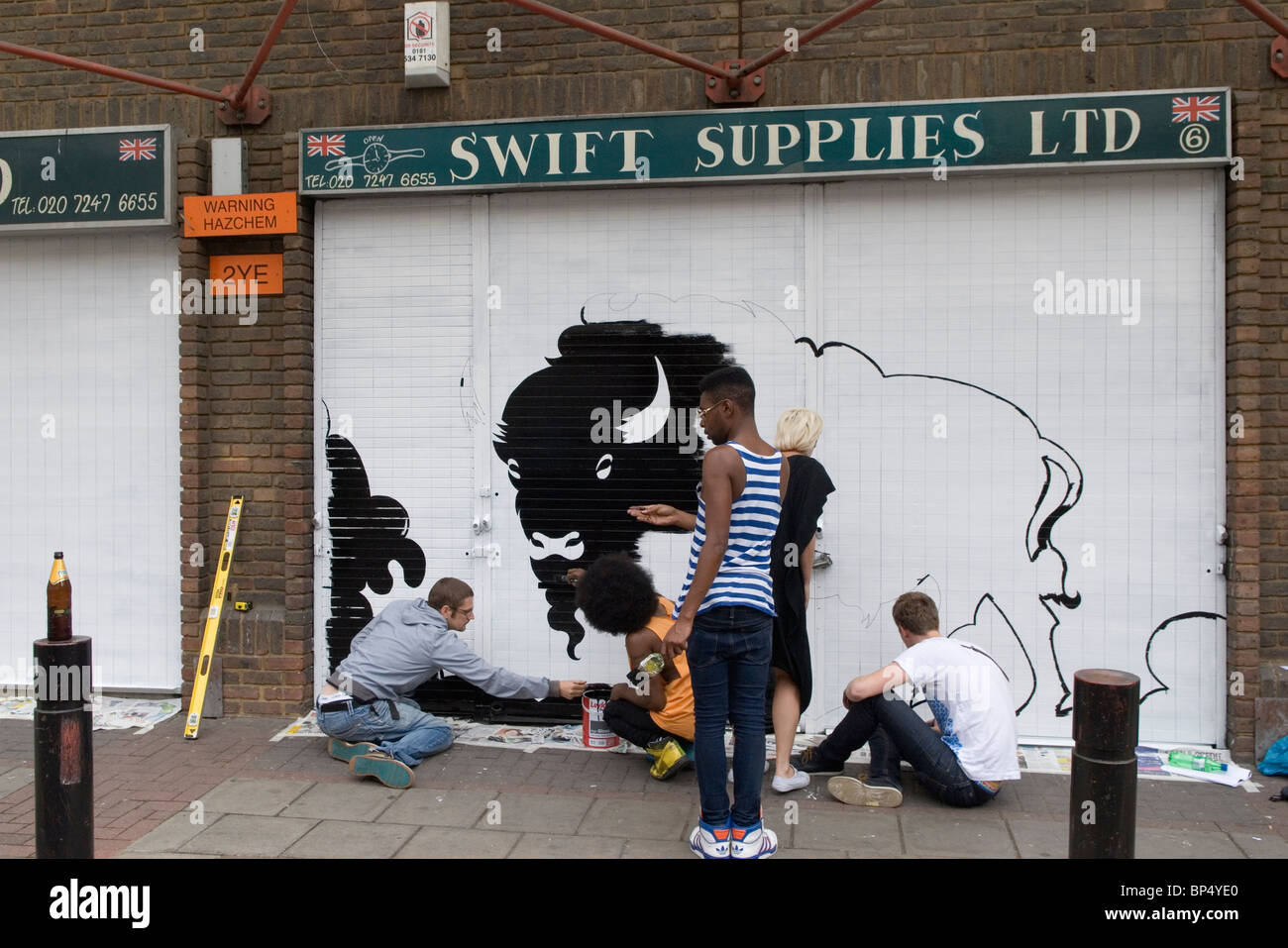Jasper Goodall graphic street artist making an art work New Goulston ...