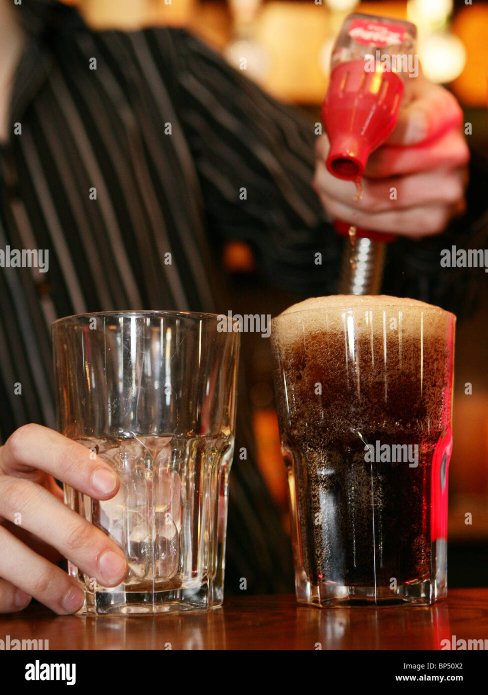 Barmen pouring a Fizzy Soft Drink Stock Photo - Alamy