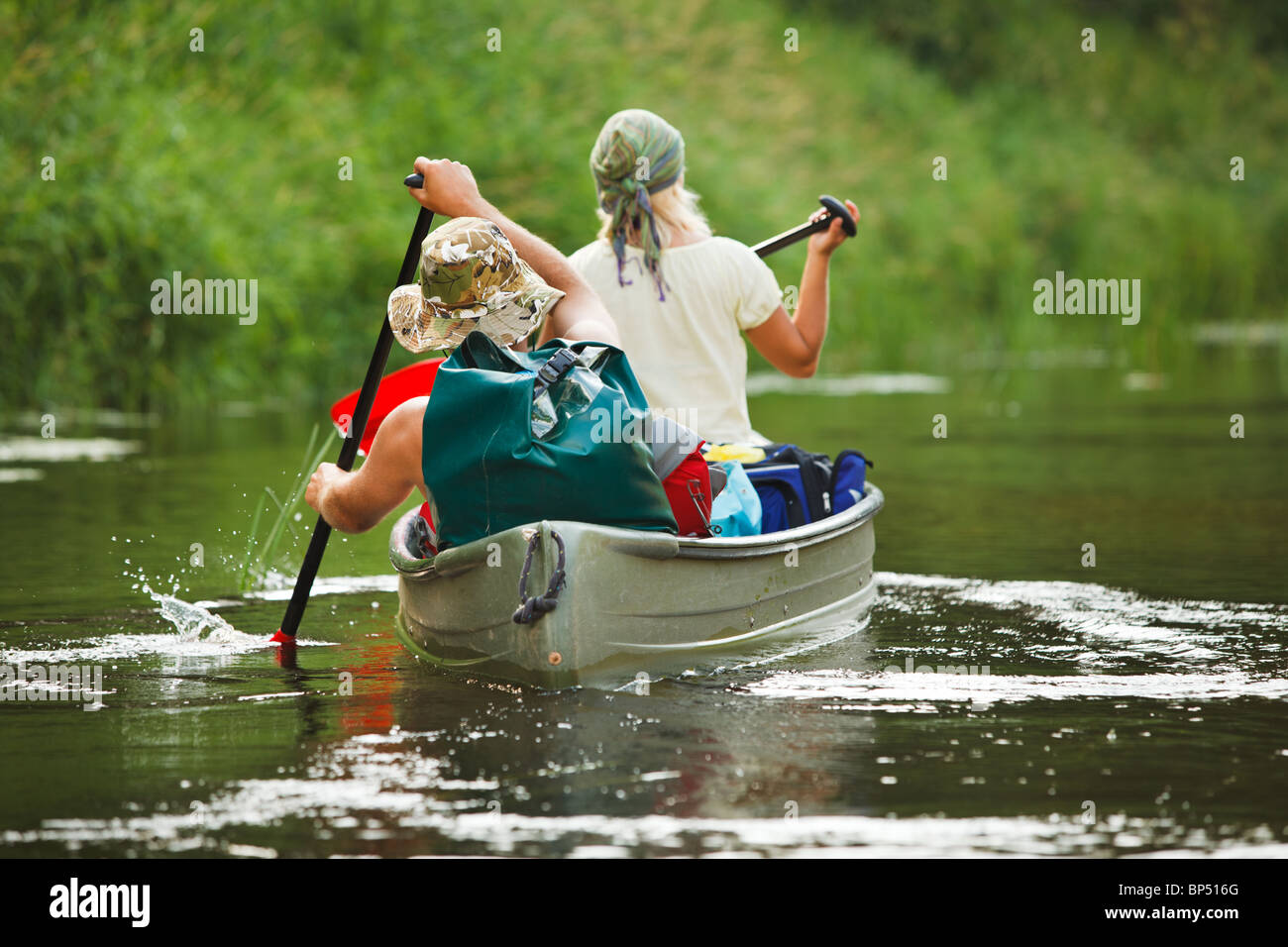 People boating on river Stock Photo - Alamy