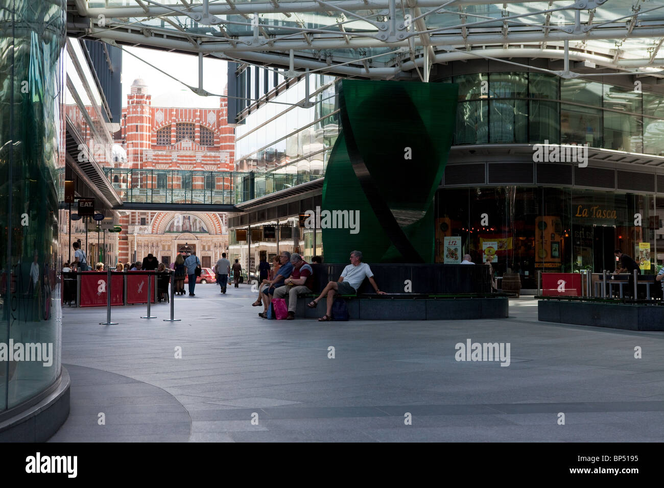 Shoppers and office workers meander through the Cardinal Place shopping ...