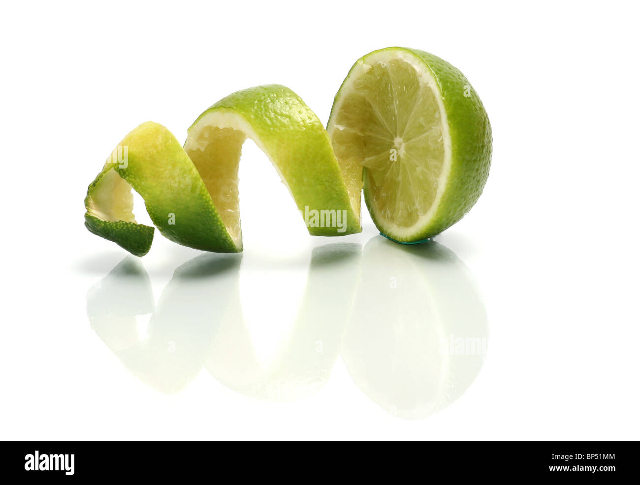 spiral shape lime skin on white background Stock Photo - Alamy